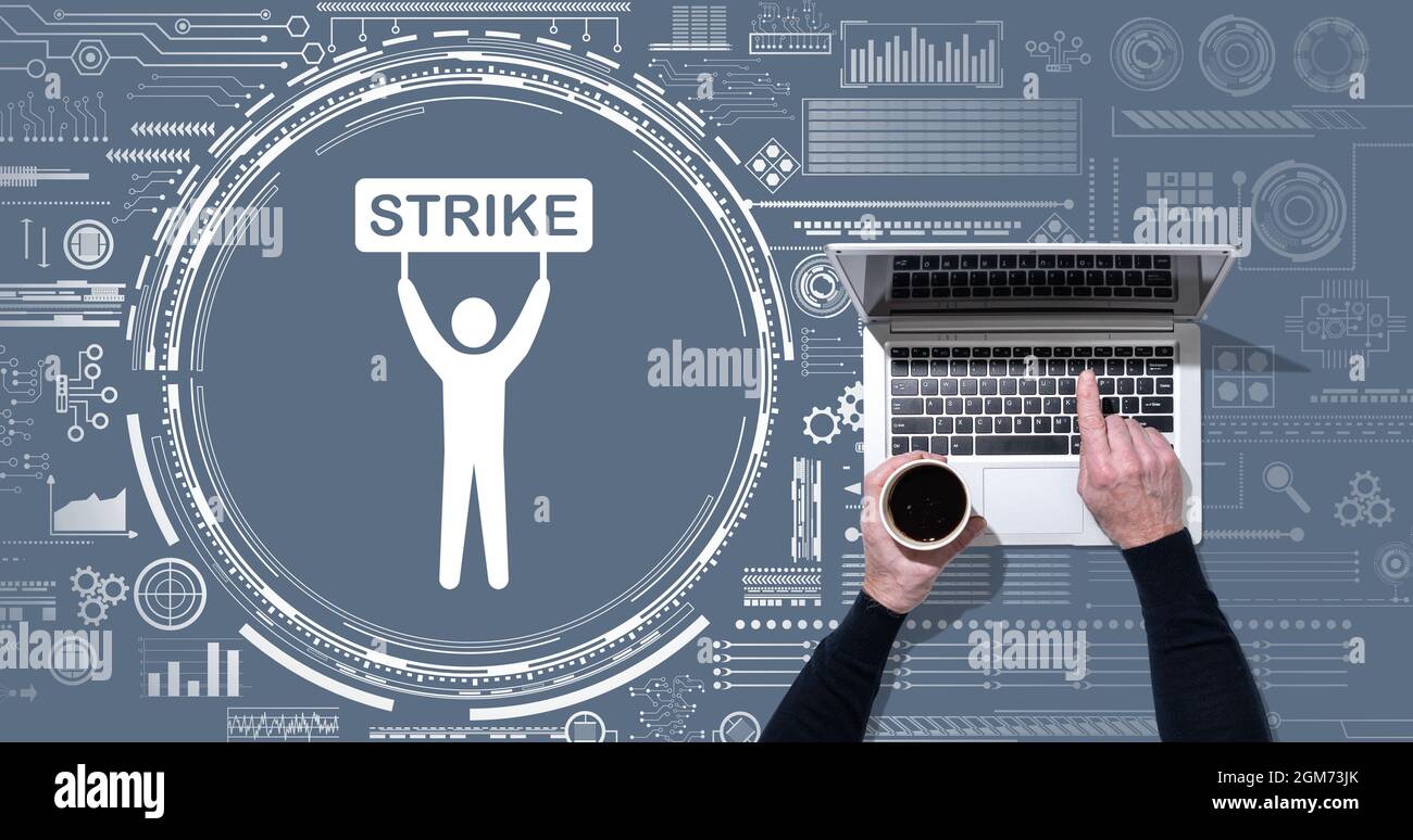 Top view of hands using laptop with symbol of strike concept Stock ...