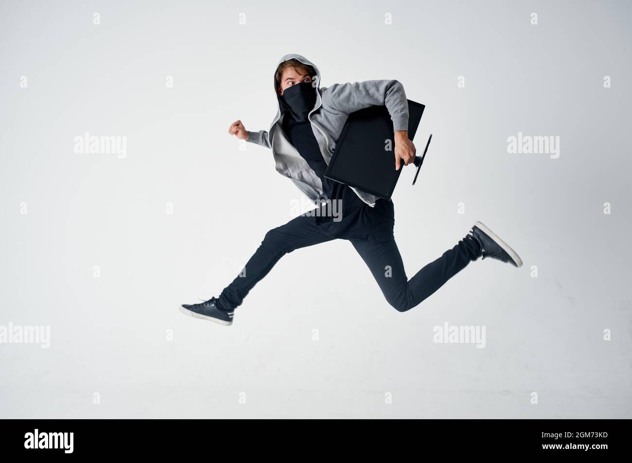 hacker stealth technique robbery safety hooligan light background Stock ...