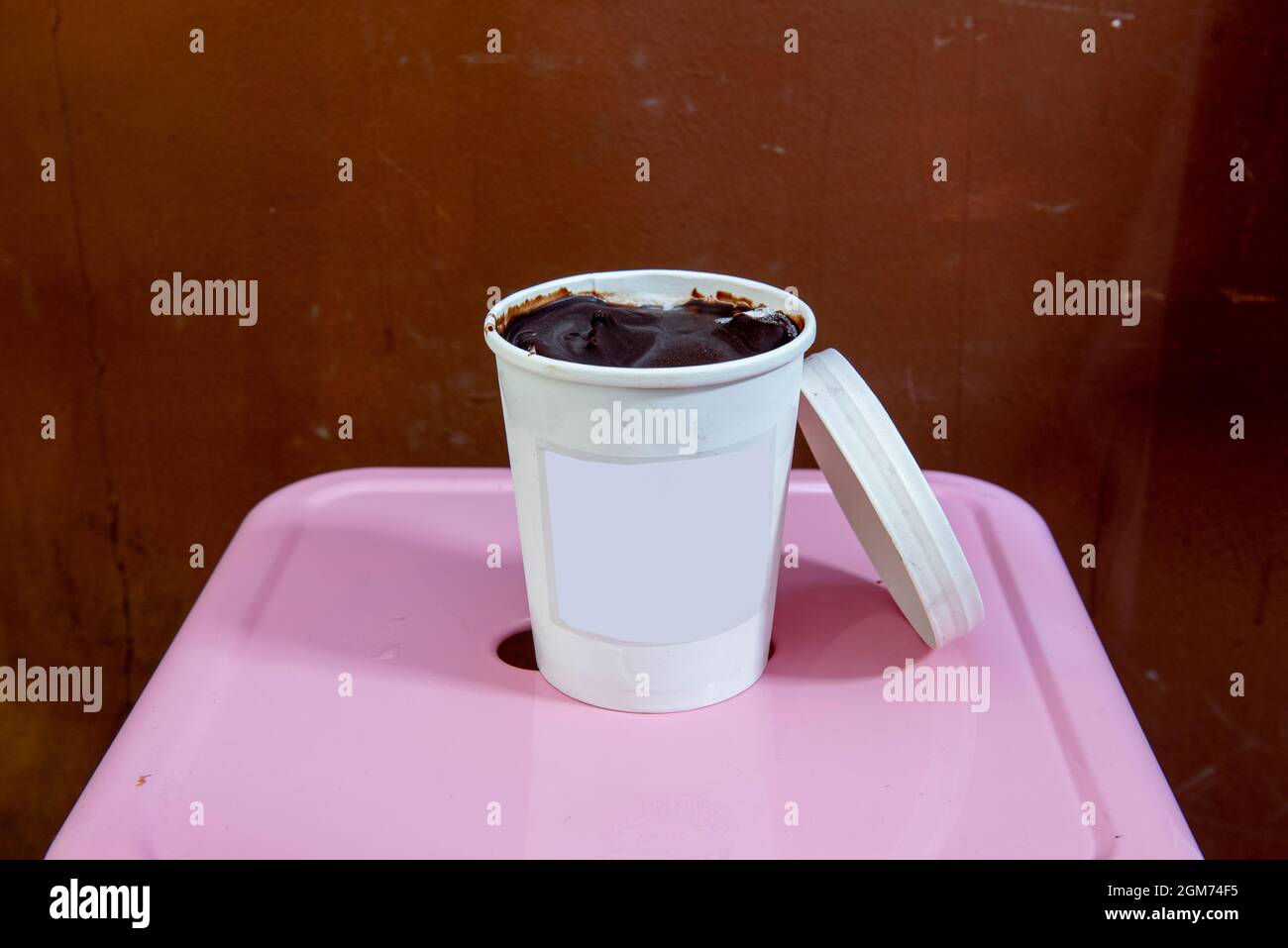 Half a kilo ice cream tub of cream and chocolate flavor in home ...