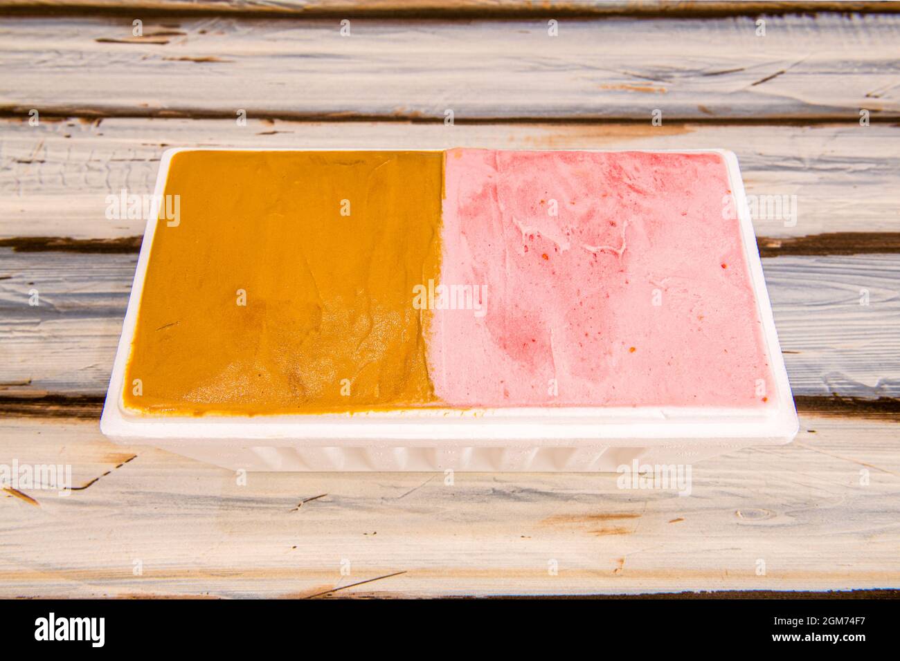 Kilo ice cream tub with two flavors in home delivery container Stock ...