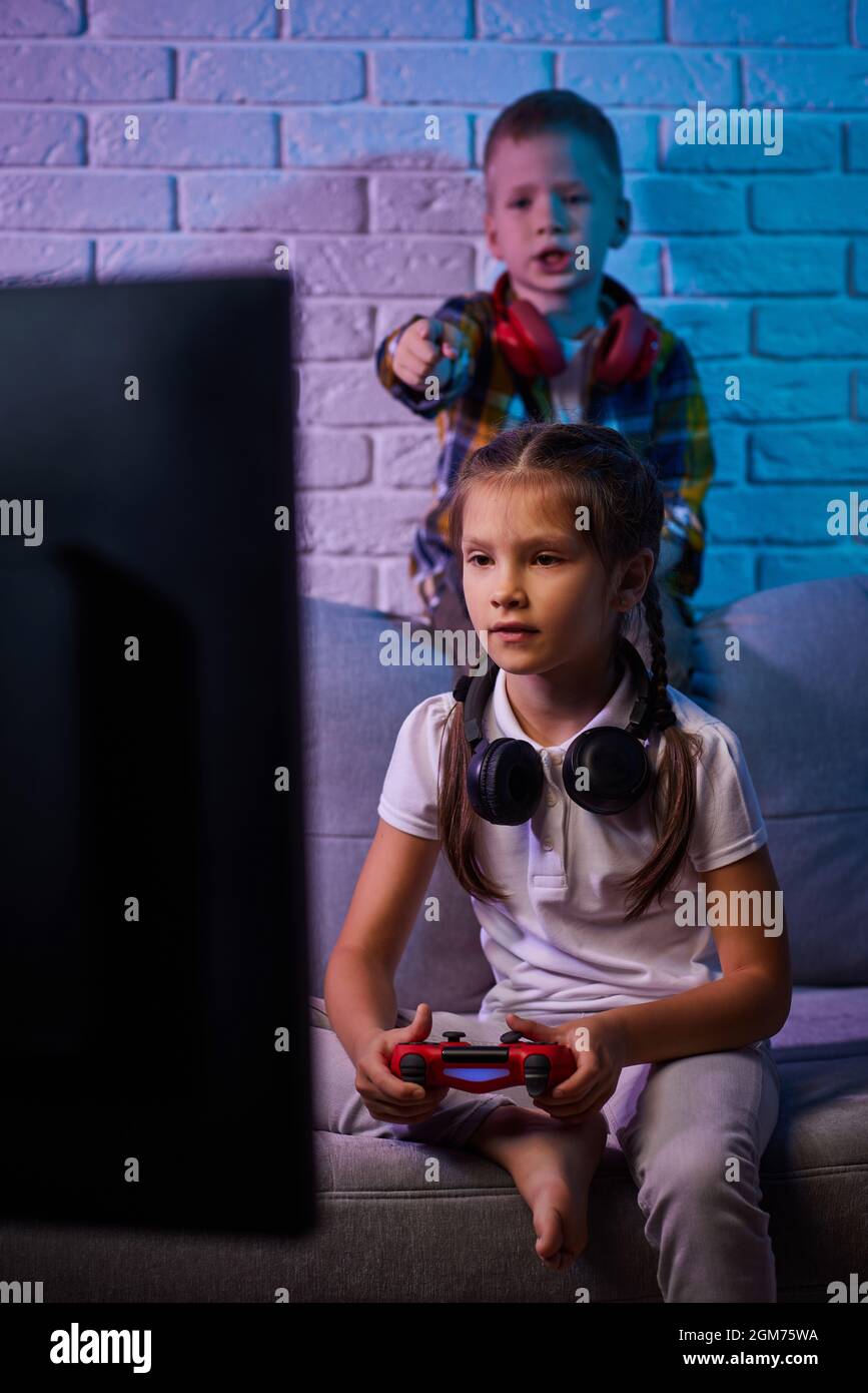 children playing video game with game console Stock Photo - Alamy