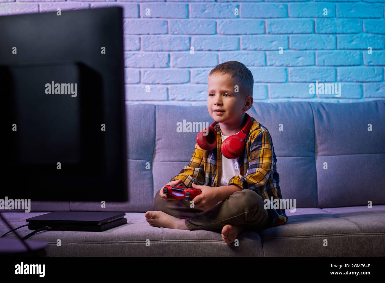 children playing video game with game console Stock Photo - Alamy