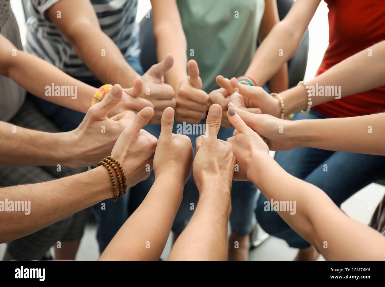 People putting hands together as symbol of unity Stock Photo - Alamy