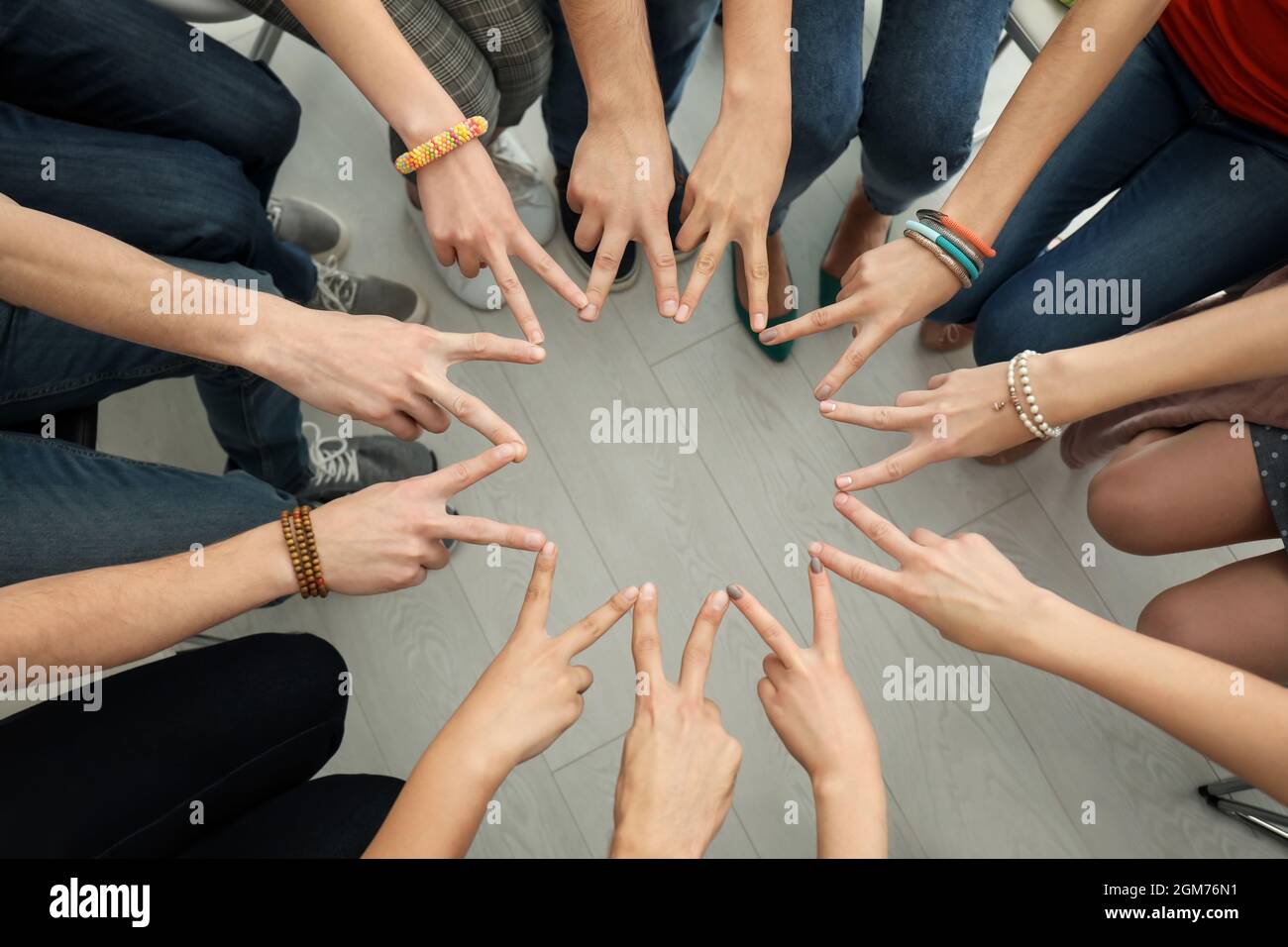People putting hands together as symbol of unity Stock Photo - Alamy