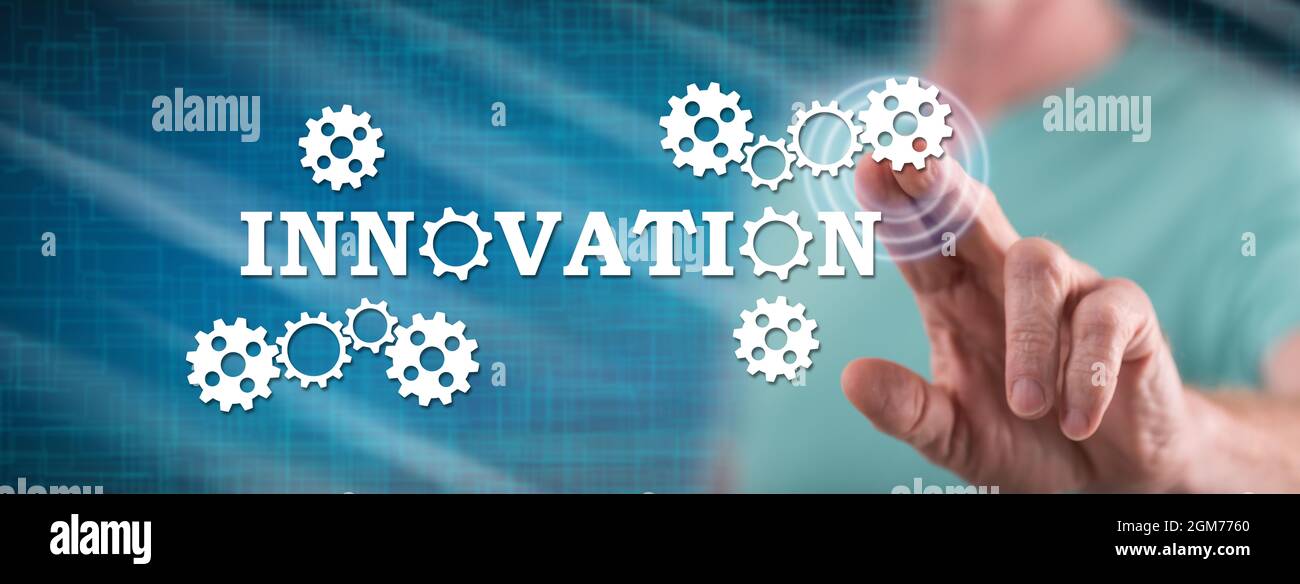 Man touching an innovation concept on a touch screen with his finger ...