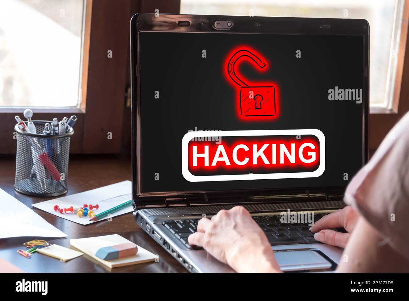 Laptop screen displaying a hacking concept Stock Photo - Alamy
