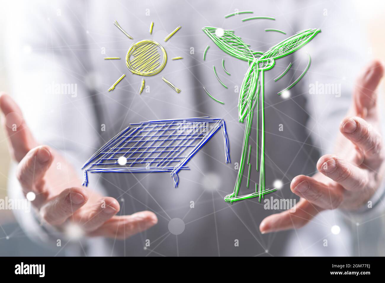 Green energy concept above the hands of a man in background Stock Photo ...