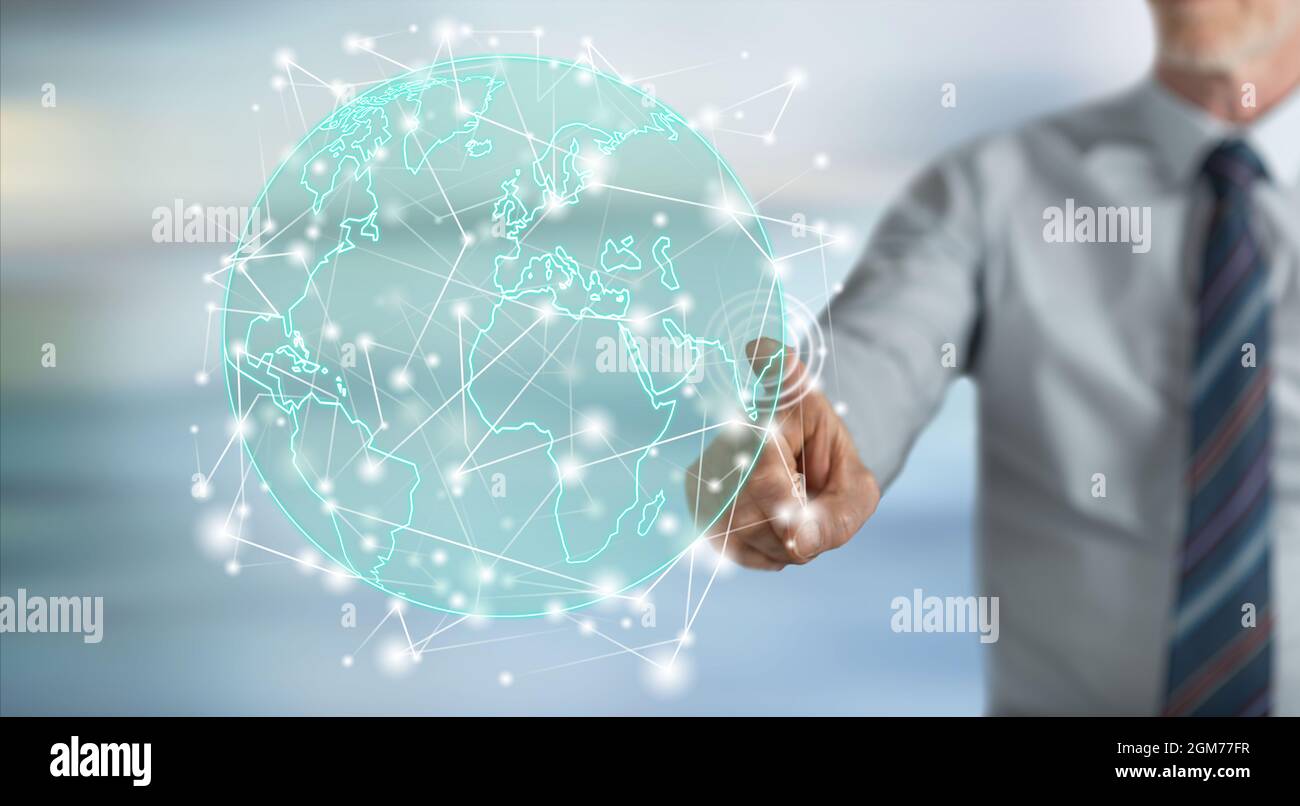 Man touching a global connection concept on a touch screen with his ...