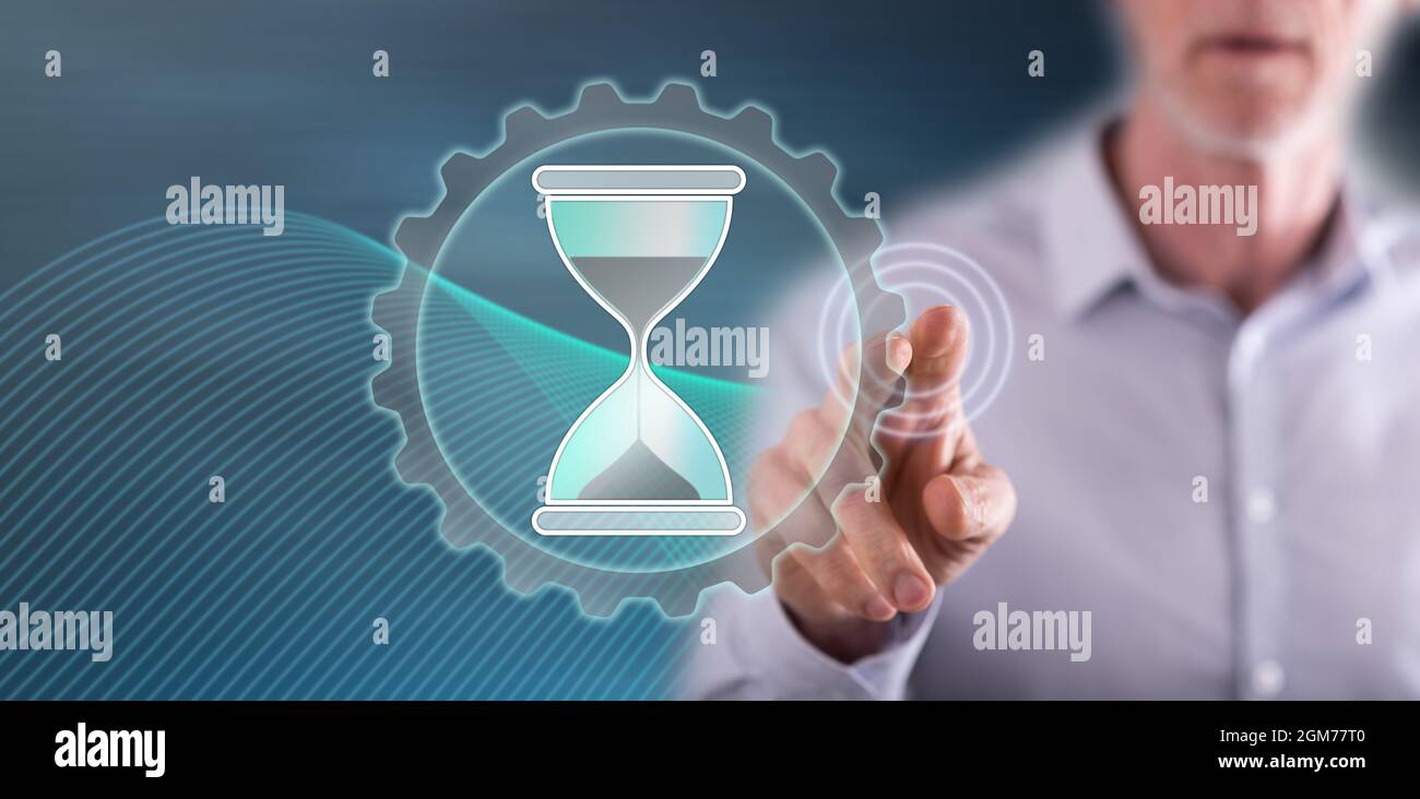 Man touching a time management concept on a touch screen with his ...