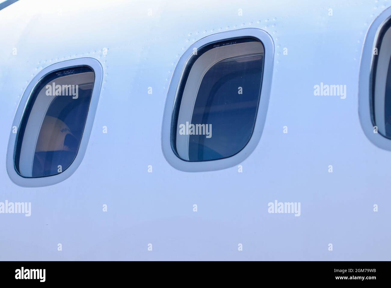 View of two passenger window in fuselage of the aircraft Stock Photo ...