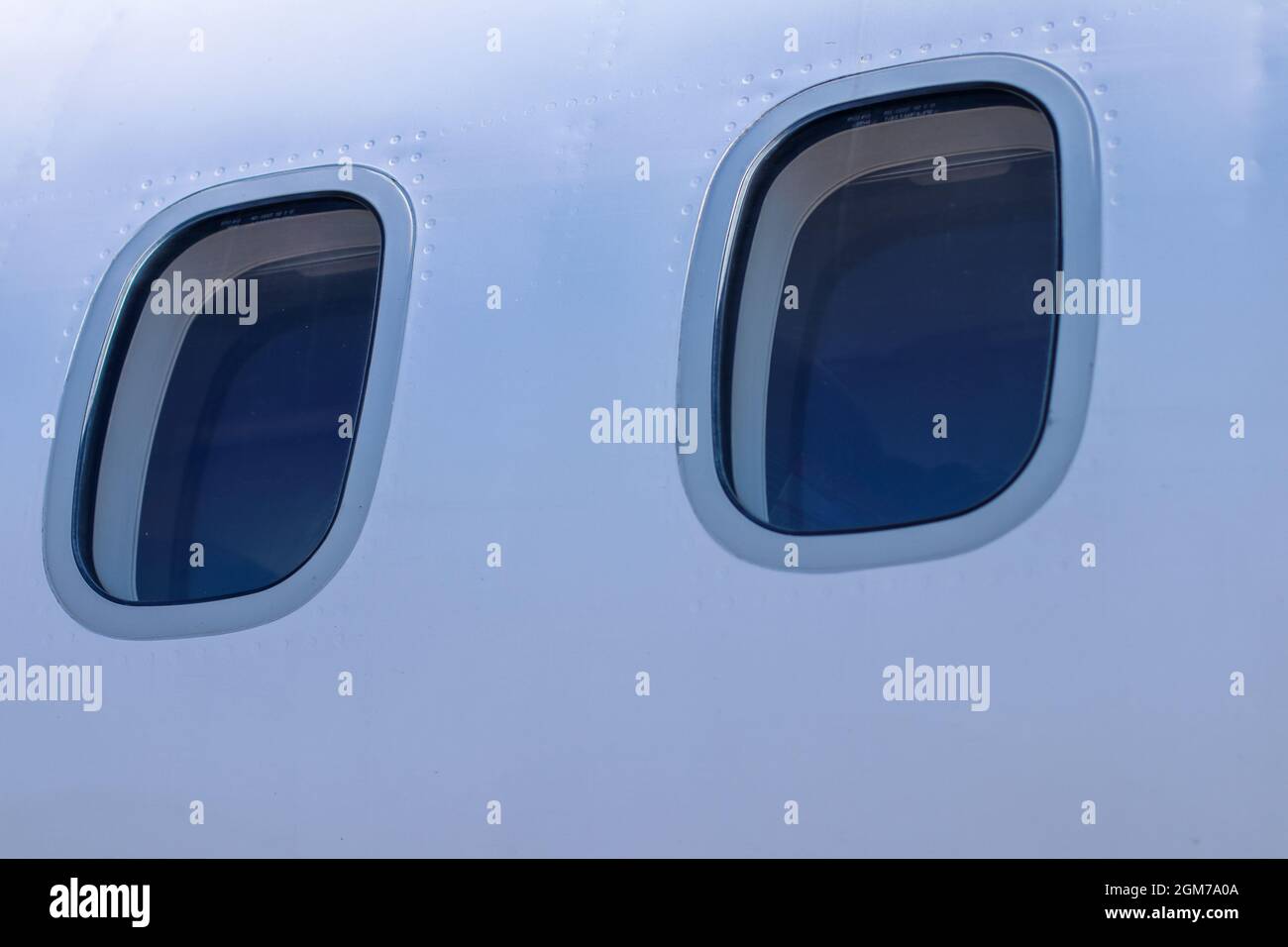 View of two passenger window in fuselage of the aircraft Stock Photo ...