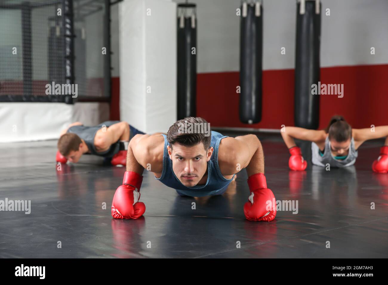 Young boxers warming up before training in gym Stock Photo - Alamy