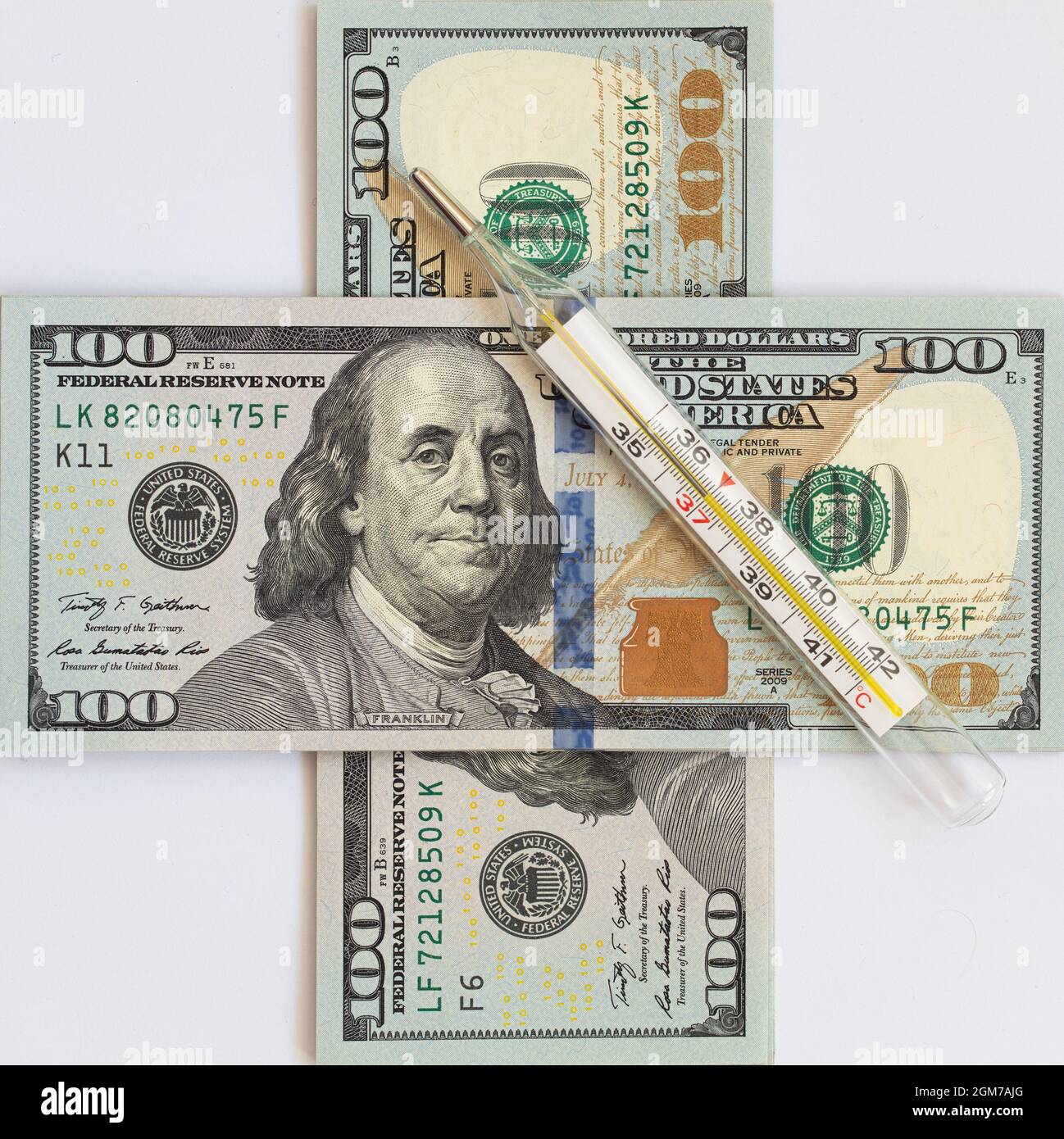 100 dollar bill and thermometer Stock Photo - Alamy