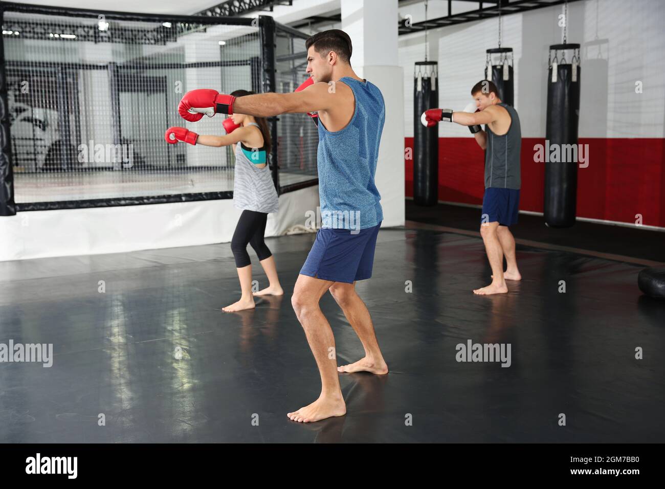 Young boxers warming up before training in gym Stock Photo - Alamy
