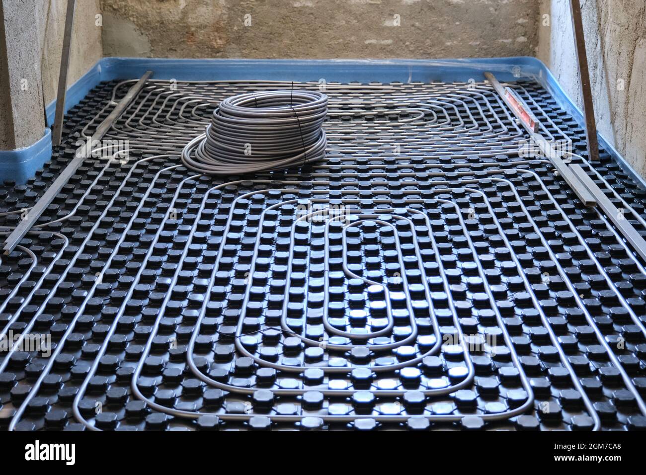 Radiant floor construction installation with flexible pipes Stock Photo ...