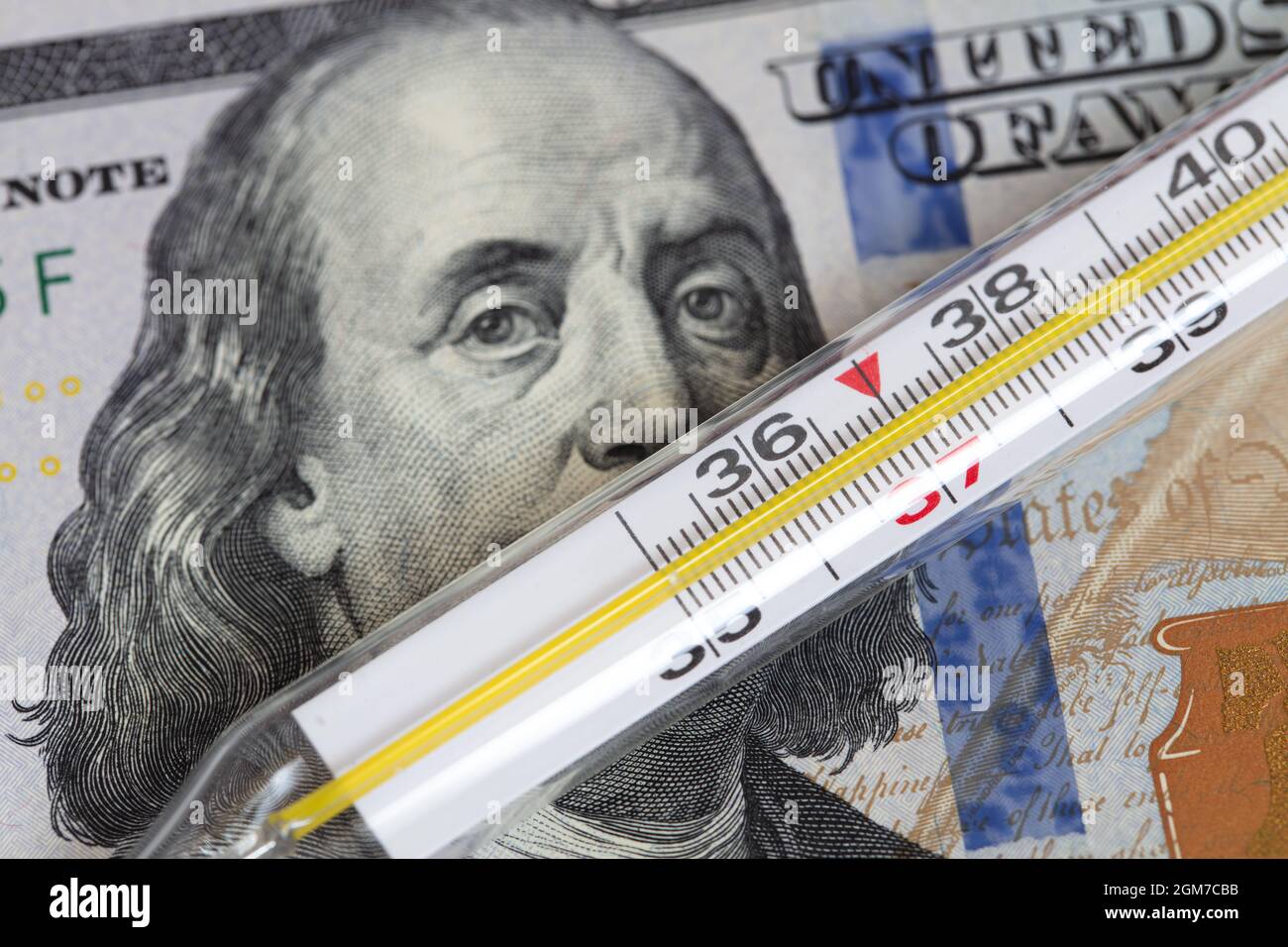 100 dollar bill and thermometer Stock Photo - Alamy