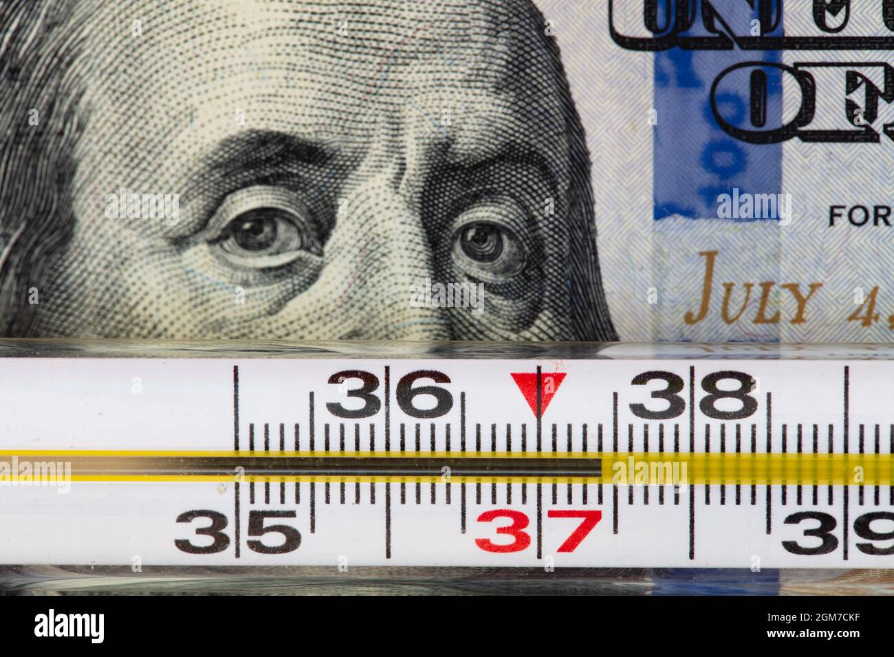 100 dollar bill and thermometer Stock Photo - Alamy