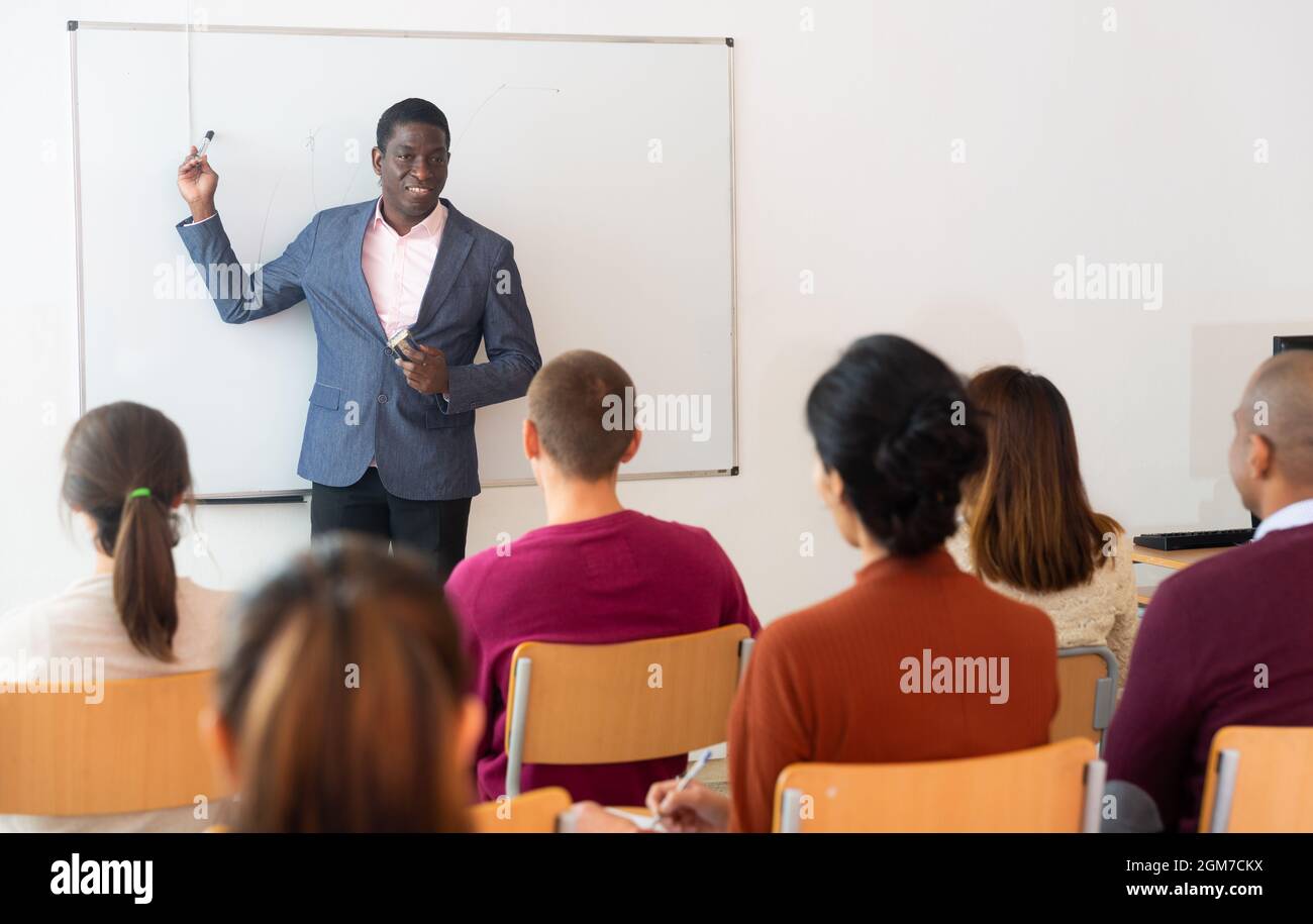 African american male teacher lecturing to adult students Stock Photo ...