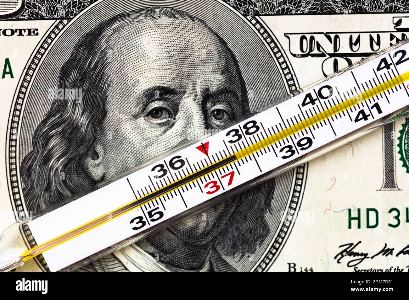 100 dollar bill and thermometer Stock Photo - Alamy
