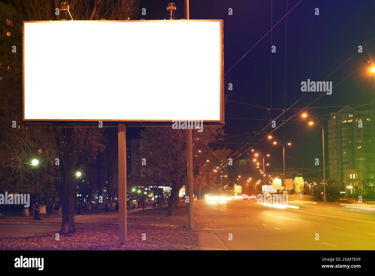 Blank advertising board on city street at night Stock Photo - Alamy