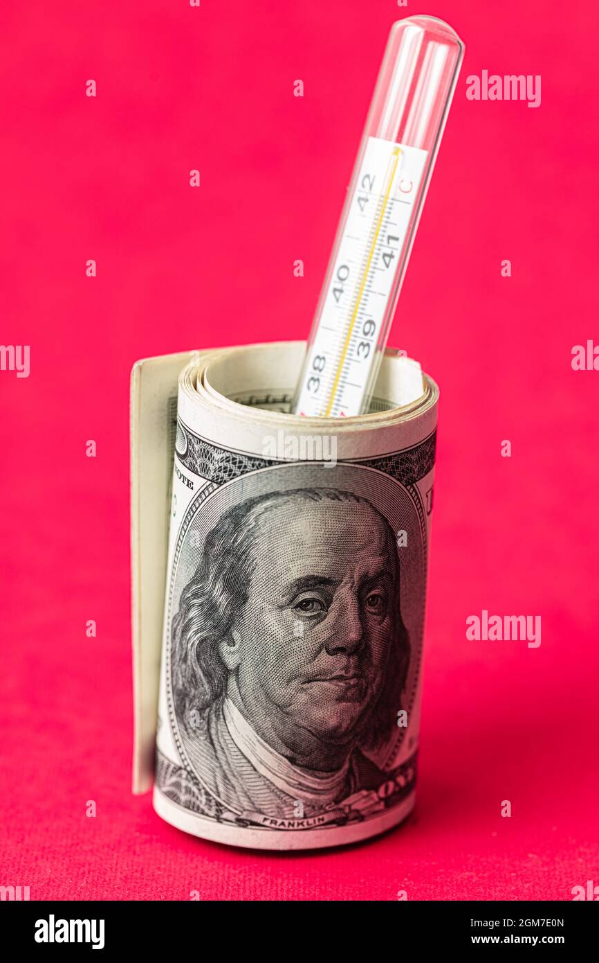 100 dollar bill and thermometer Stock Photo - Alamy