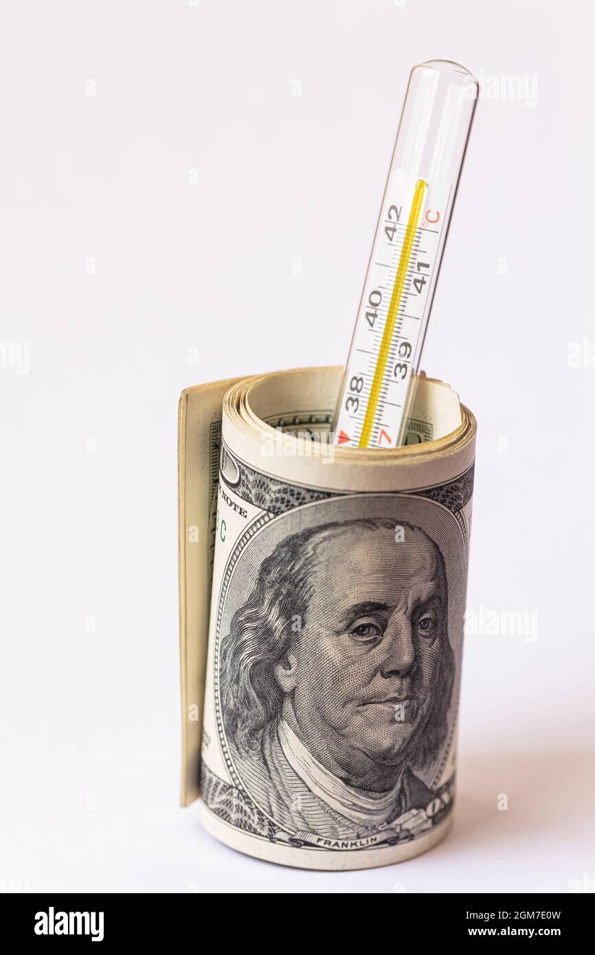 100 dollar bill and thermometer Stock Photo - Alamy