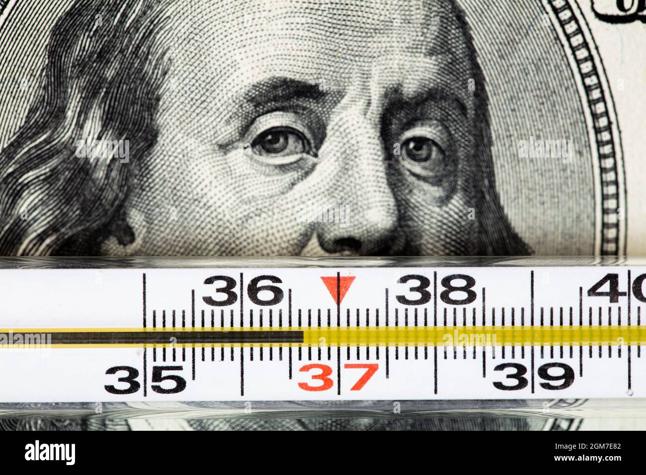 100 dollar bill and thermometer background Stock Photo - Alamy