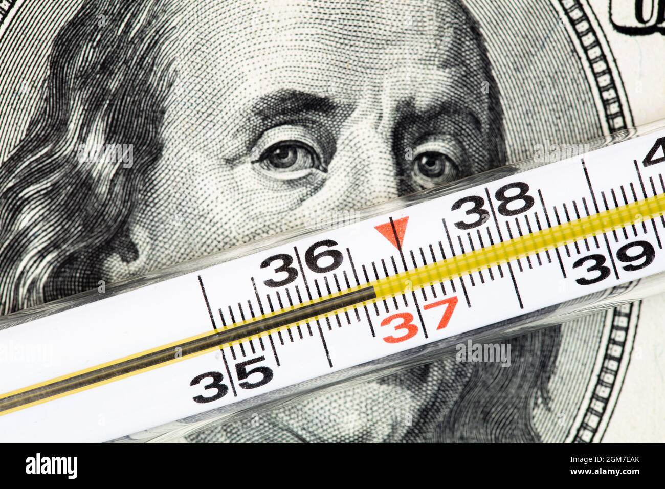 100 dollar bill and thermometer background Stock Photo - Alamy