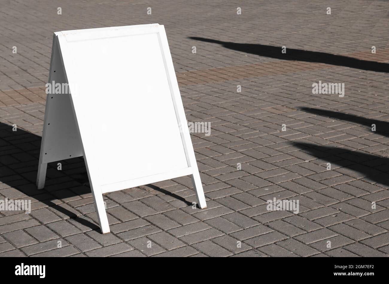 Blank advertising board on city street Stock Photo - Alamy
