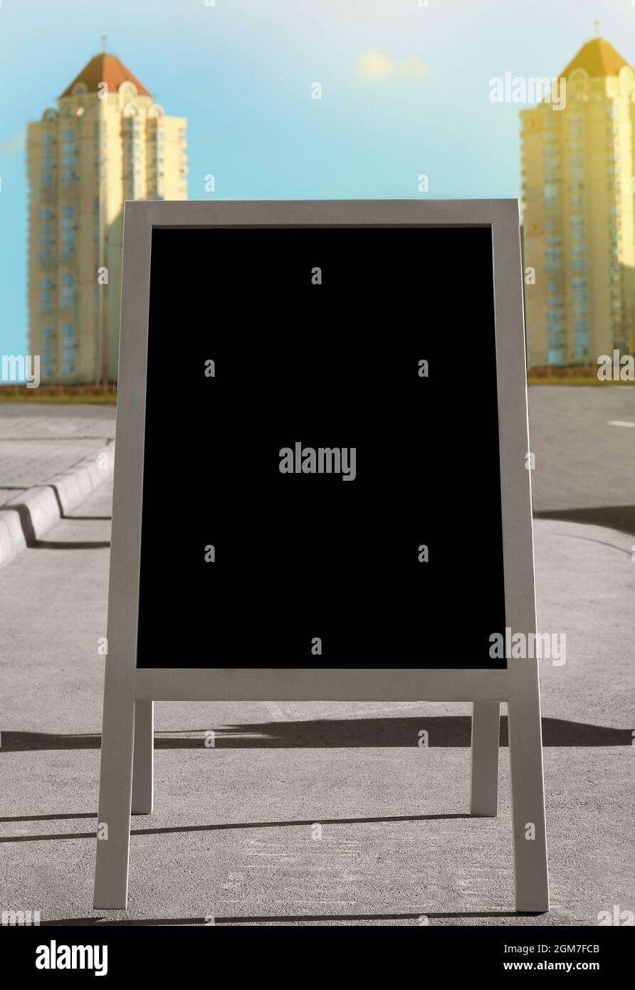 Blank advertising board on city street Stock Photo - Alamy