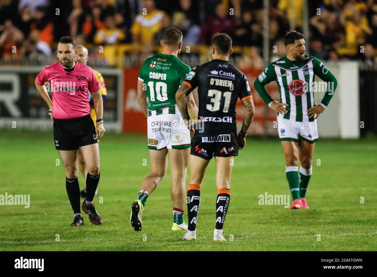 Referee Liam Moore, Mike Cooper (10) of Warrington Wolves, Gareth O ...