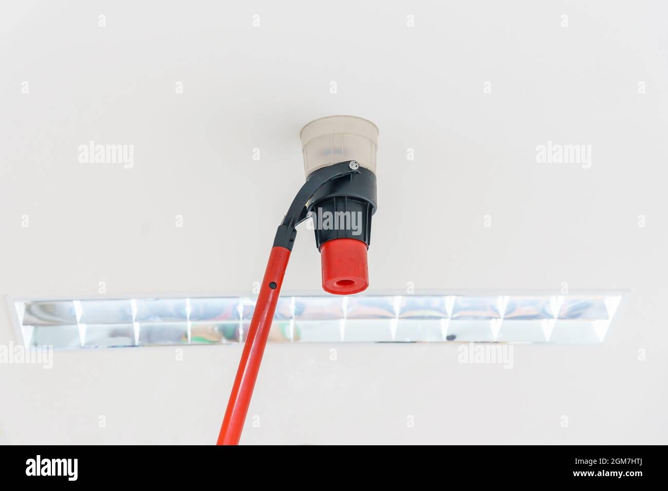 Automatic smoke detector fire alarm head on the ceiling. The smoke ...