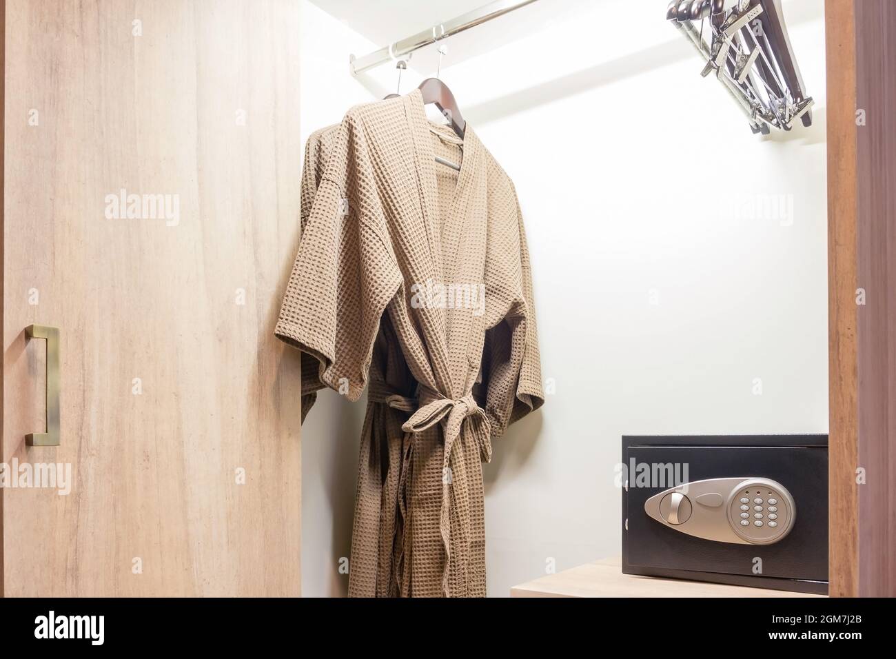 Bathrobe and safe box with electronic lock hidden in the wardrobe at ...