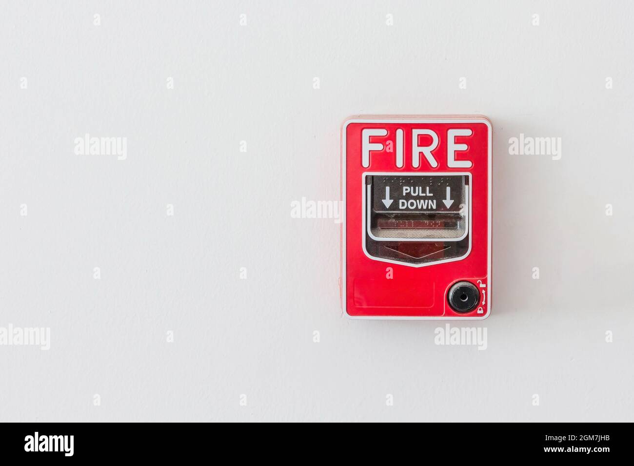 Fire alarm switch on white wall as background for warning and security ...