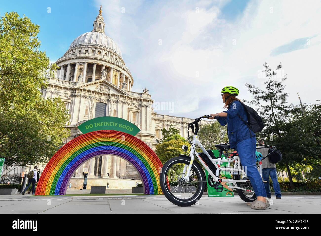 EDITORIAL USE ONLY Grace Amato looks at a 4x7 metre rainbow arch, made ...