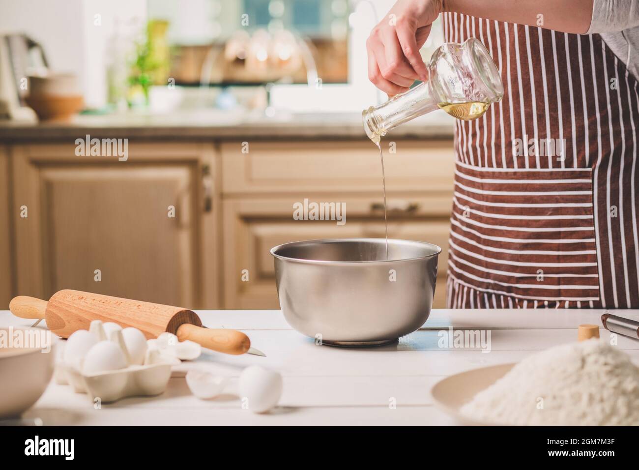 Closeup woman pouring oil hi-res stock photography and images - Alamy