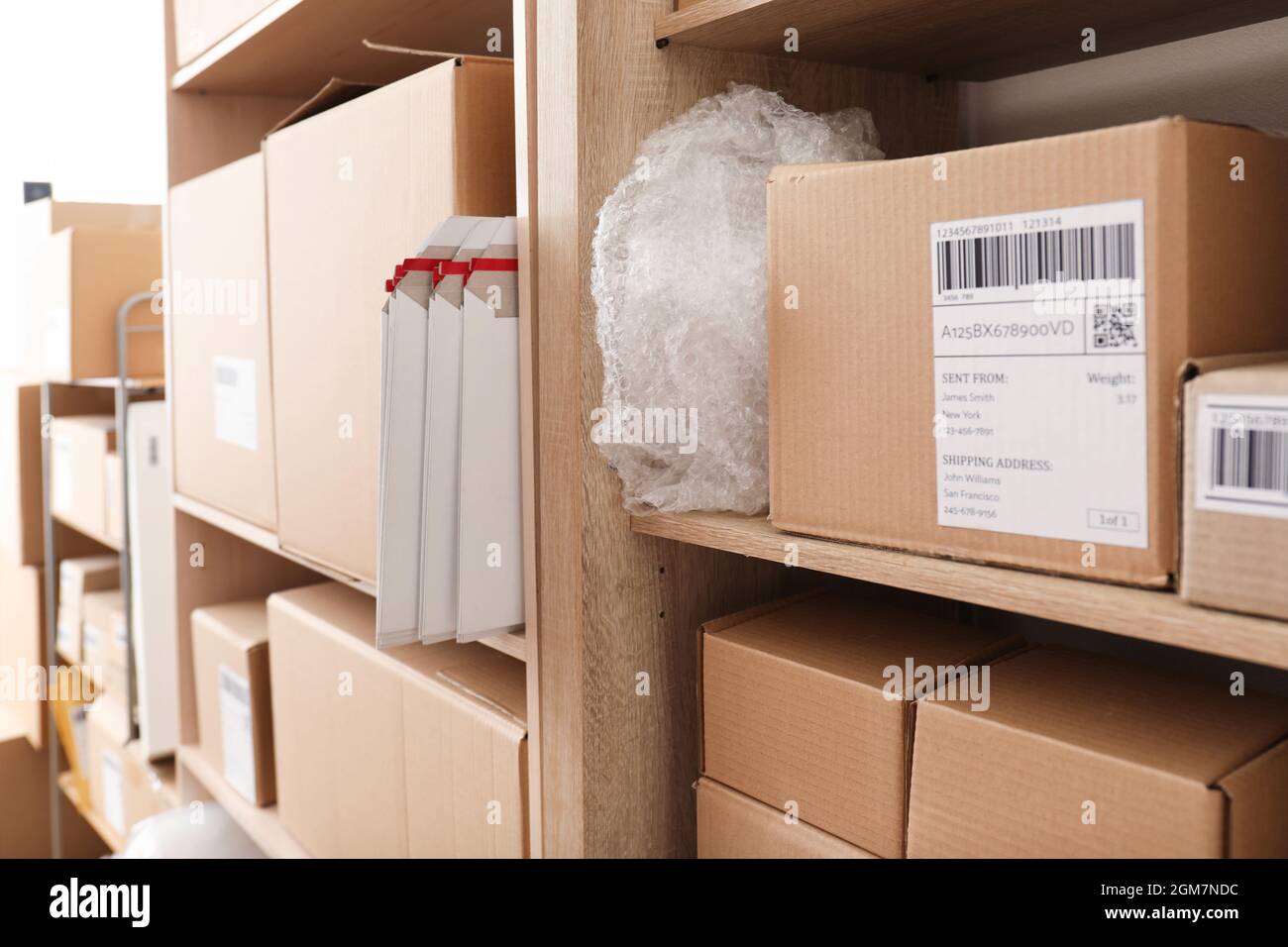 Parcels ready for shipment to client in home office Stock Photo - Alamy