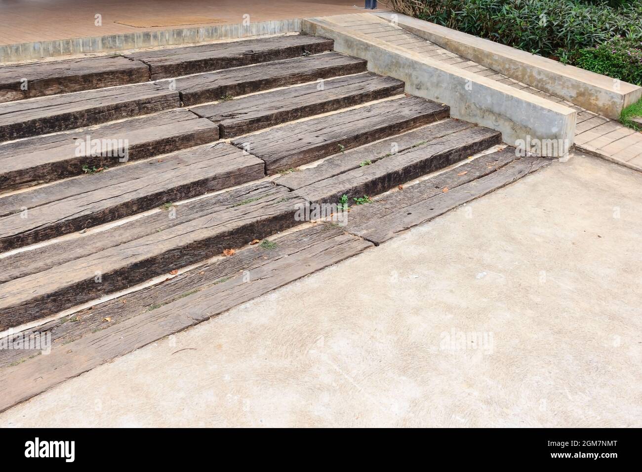 old wood staircase made from train pillow wood steps in the garden ...