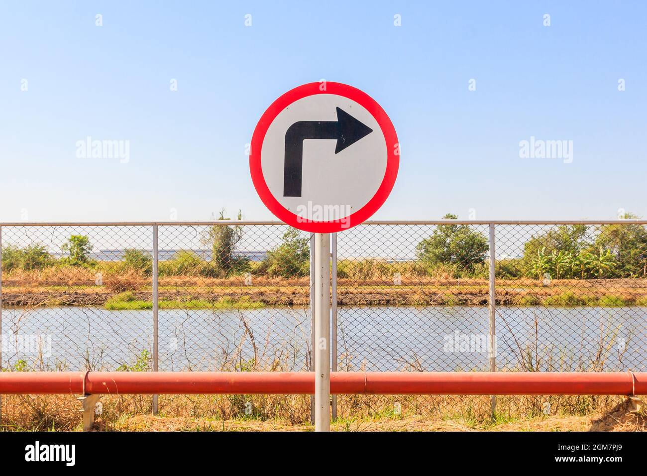 Direction sign- right turn warning on blue sky background with blank ...