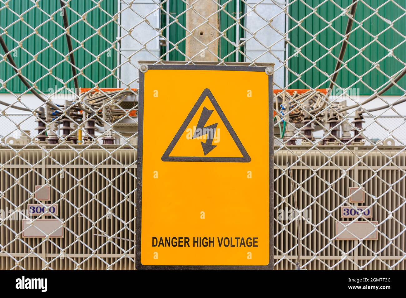 Warning sign at a work site with transformers high voltage in the ...