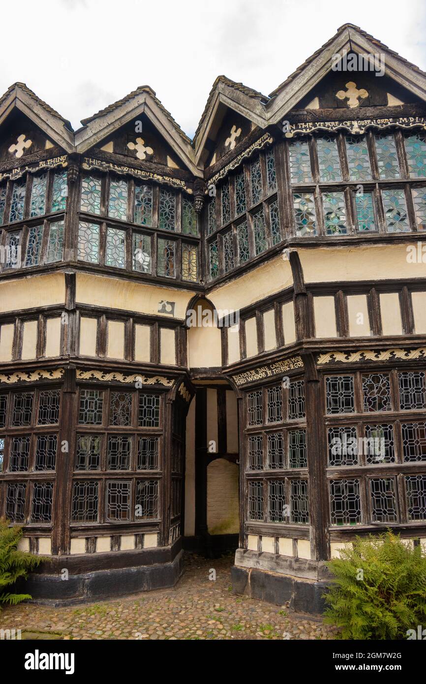 exterior of Tudor half timbered moated National Trust house Little ...