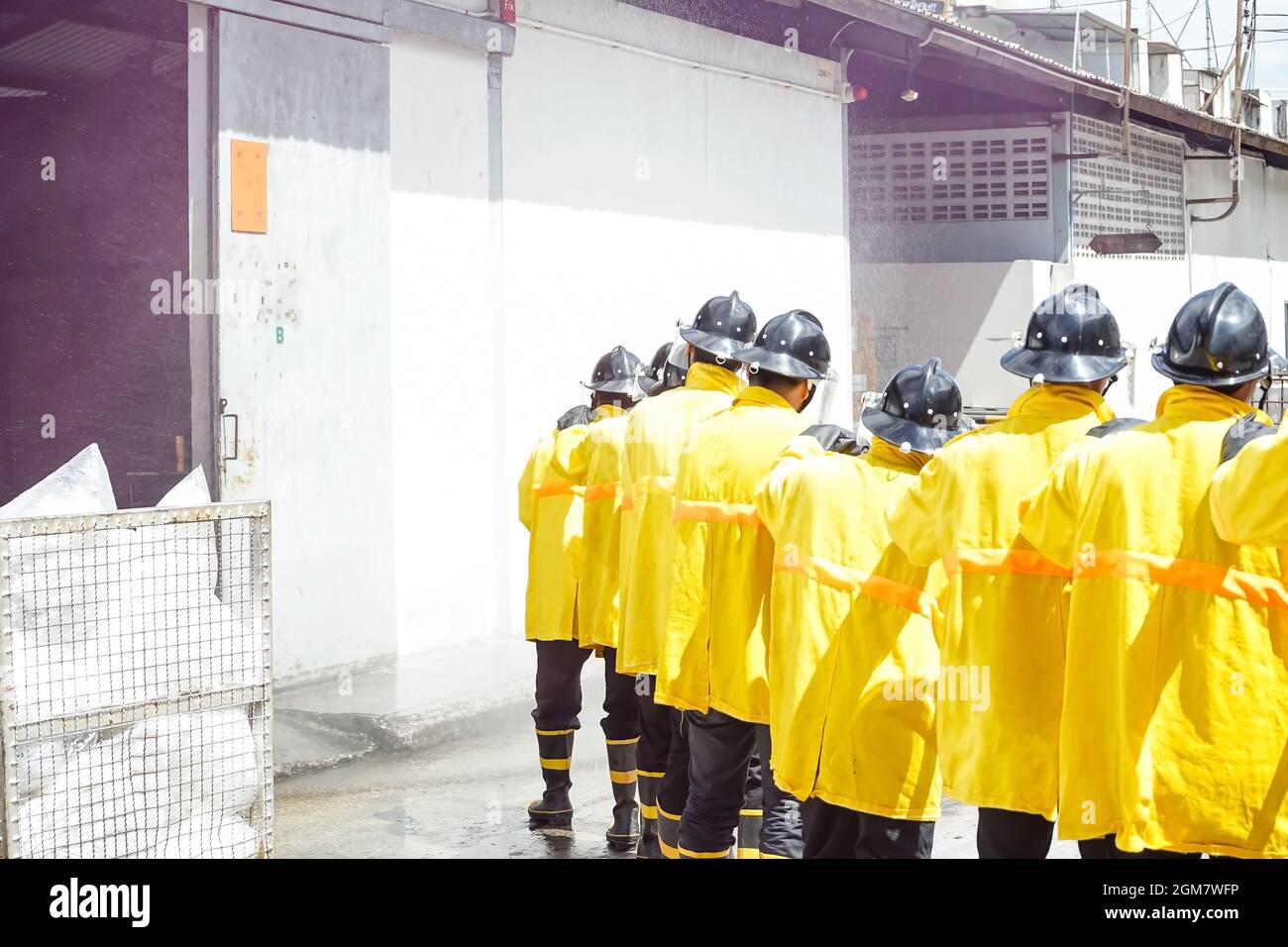 Firefighters using extinguisher and water for fighter fire during ...