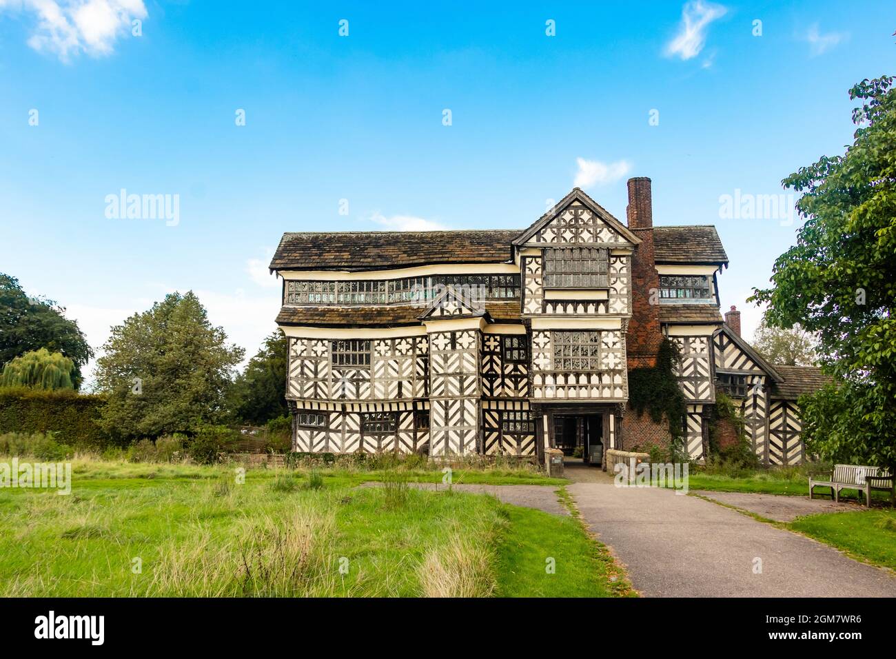 exterior of Tudor half timbered moated National Trust house Little ...