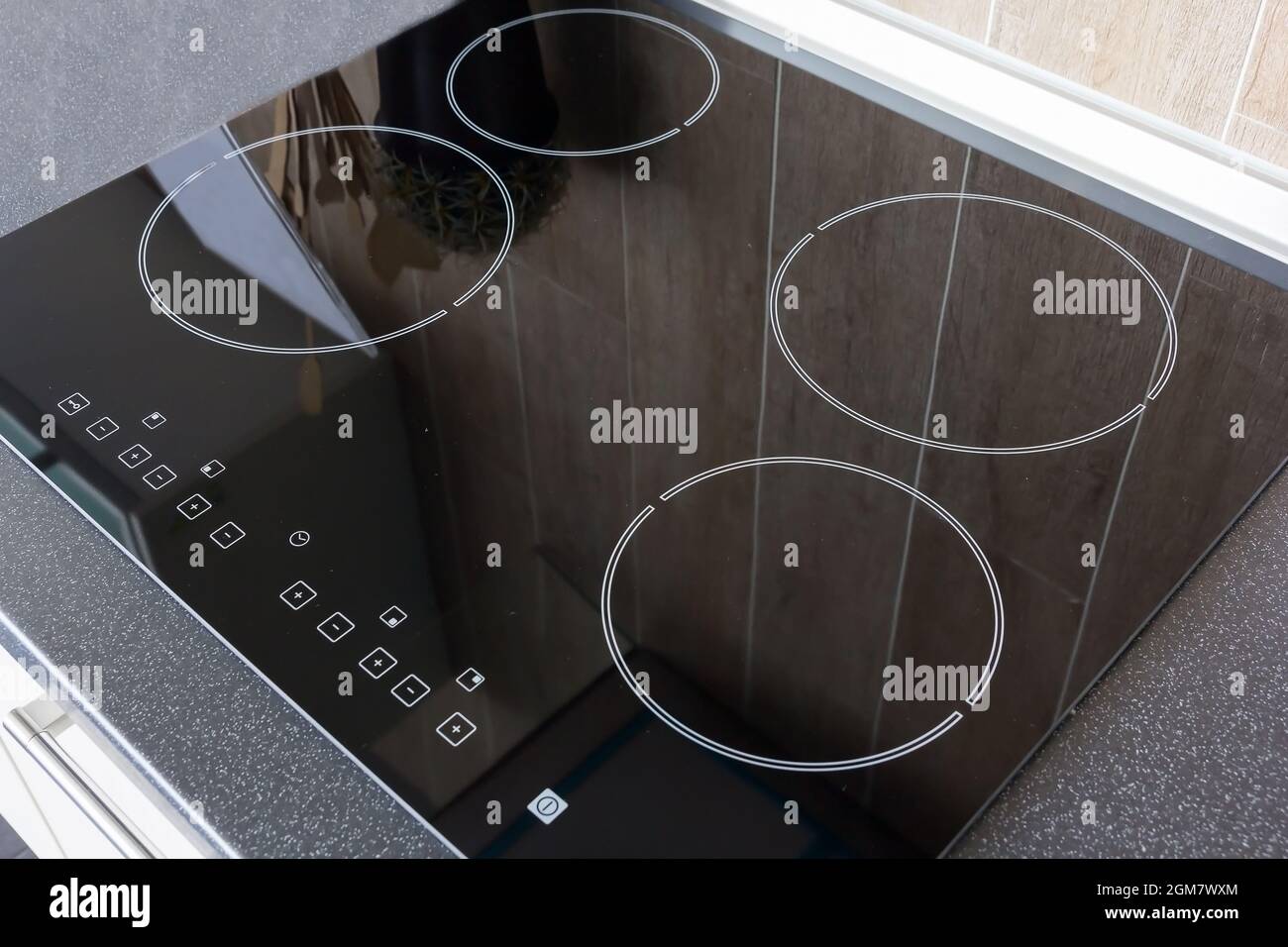 Close up view of an electrical kitchen induction ceramic hob with ...