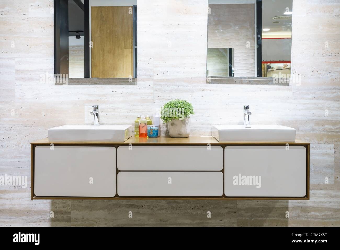bathroom interior with double sinks and mirrors in elegant home ...