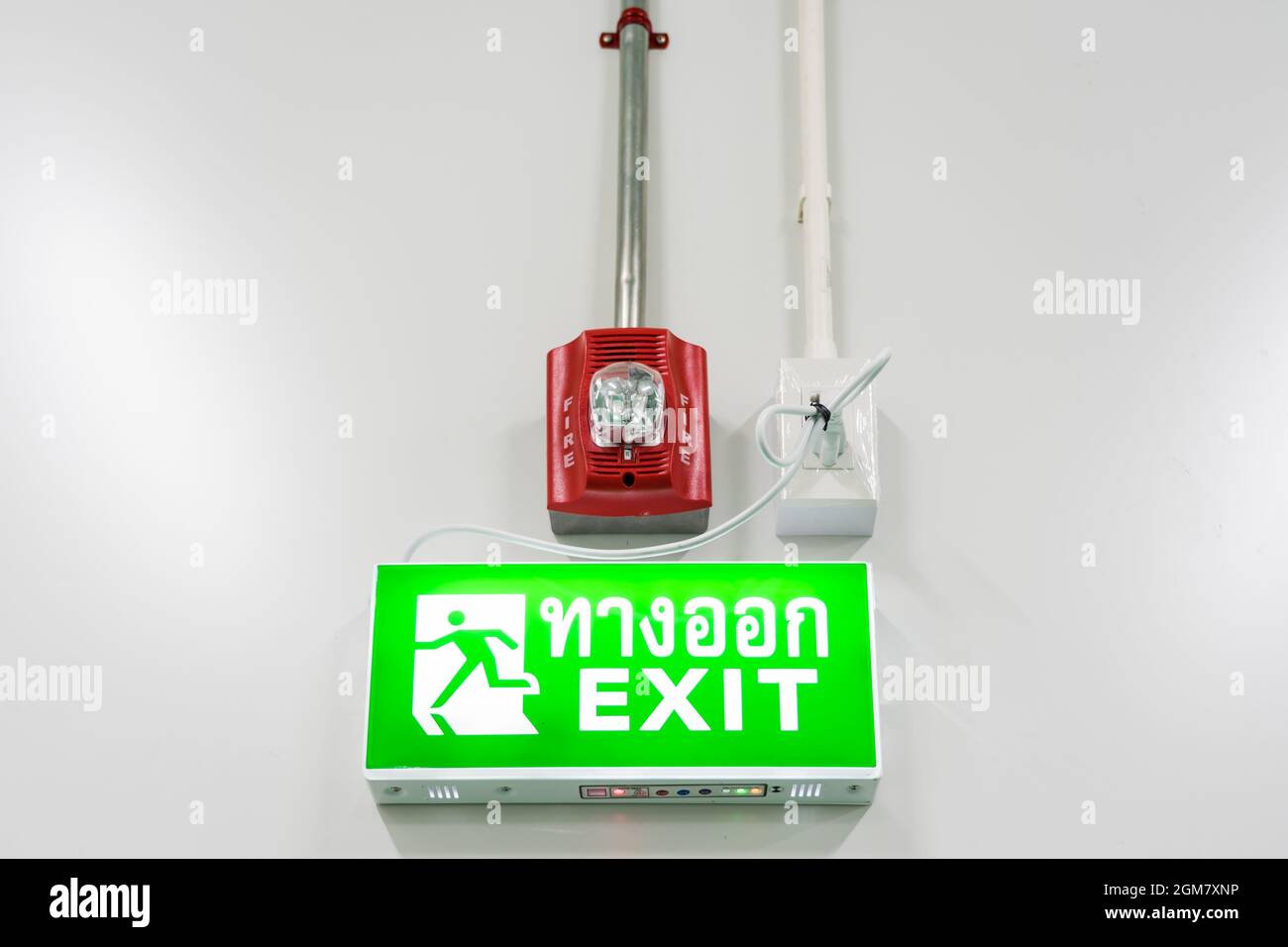 Fire protection alarm and emergency exit sign in modern offices inside ...