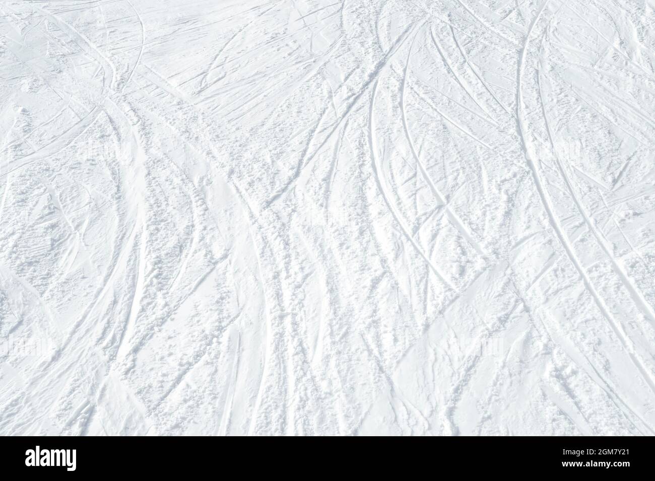 Top view of white ski tracks on snow background Stock Photo - Alamy