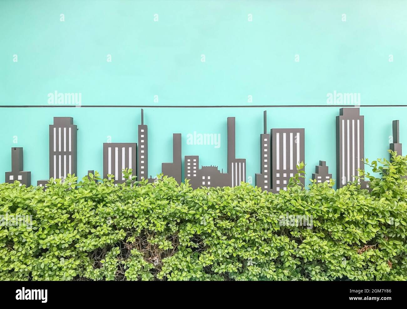 Panorama of modern building city frame on green wall with blank space ...