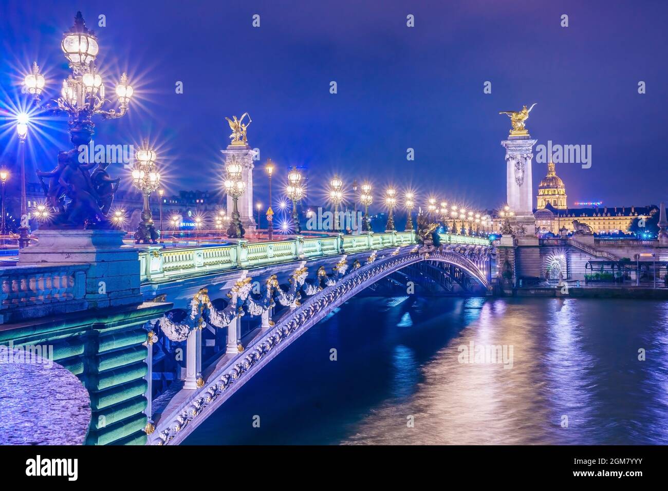 Pont Alexandre III bridge over river Seine and Hotel des Invalides in ...
