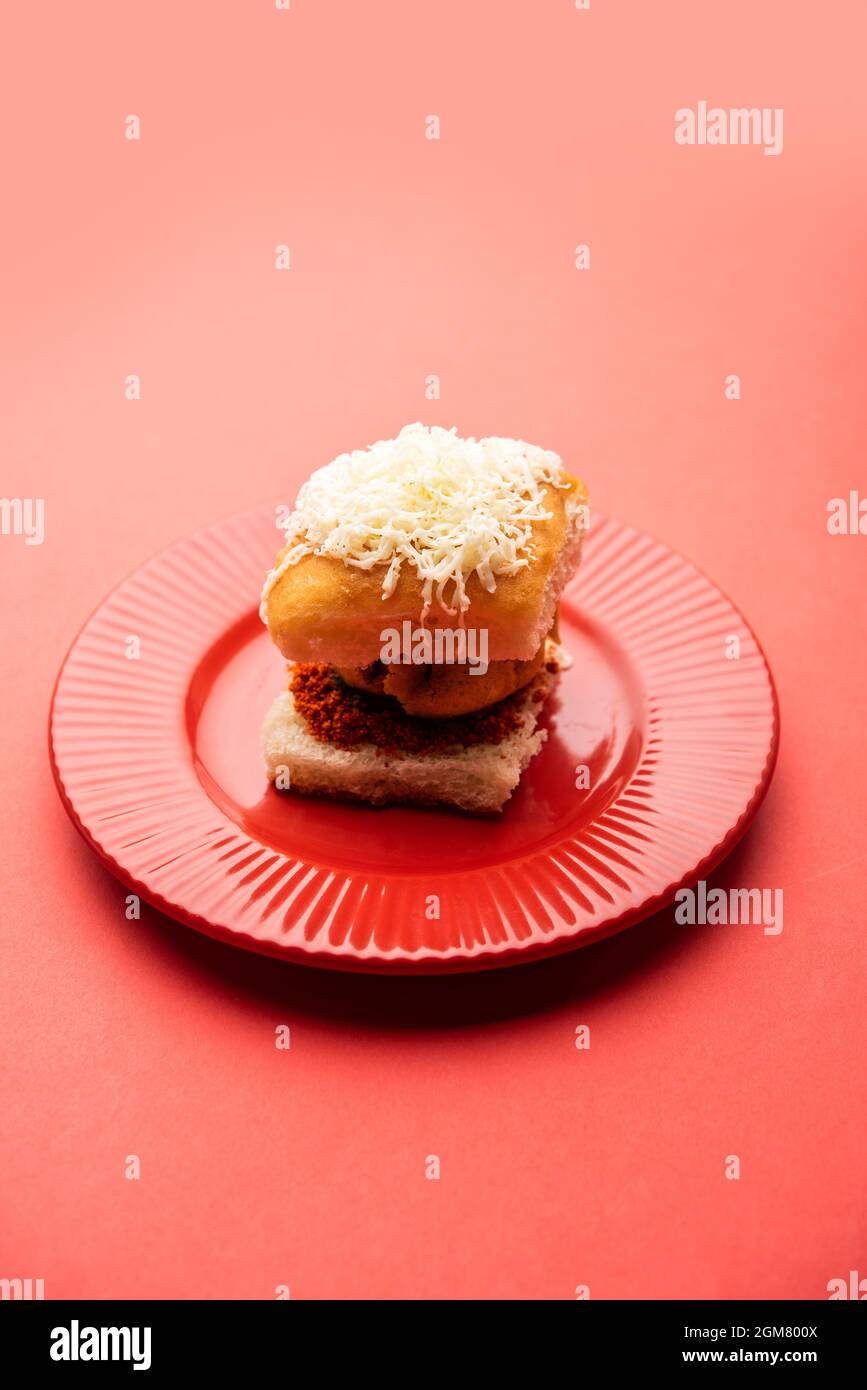 Cheese Vada pav or Grated cheese Wada Pao, popular Bombay snack food ...